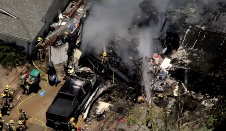 Watch: Firefighters respond to house fire and possible explosion in ...