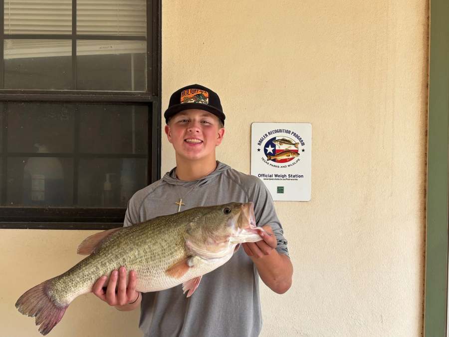 Junior angler reels in Twin Buttes Reservoir record with bass catch