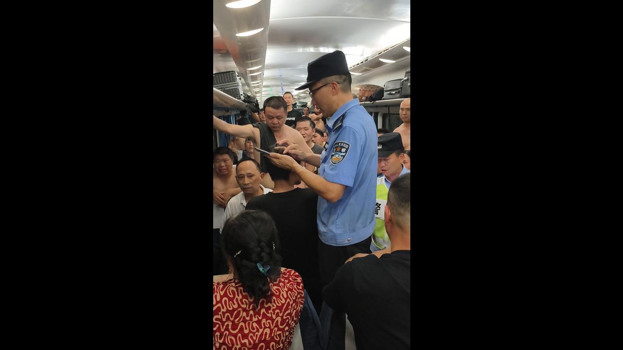 Sweating passengers smash windows on broken-down train in China