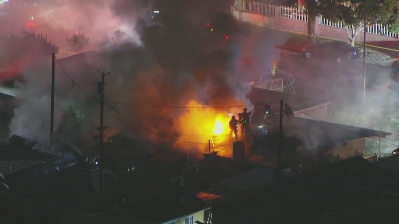Large structure fire erupts in Pacoima, 1 woman critically injured