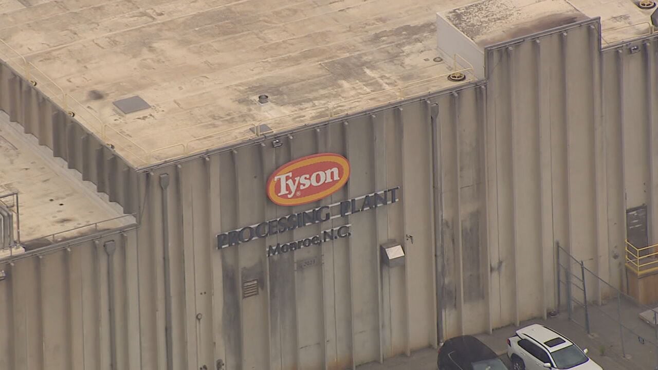 Monroe presents economic development check to Tyson Foods