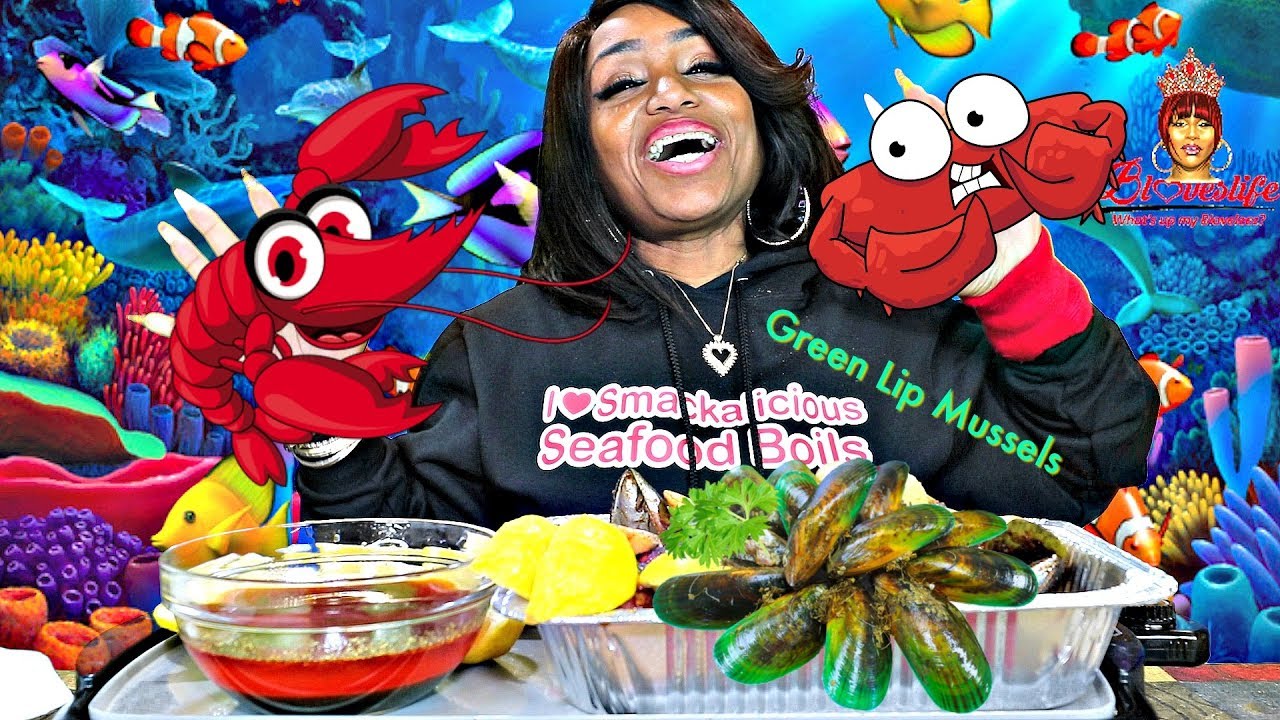 Seafood mukbang with mussels, clams, lobster, and more