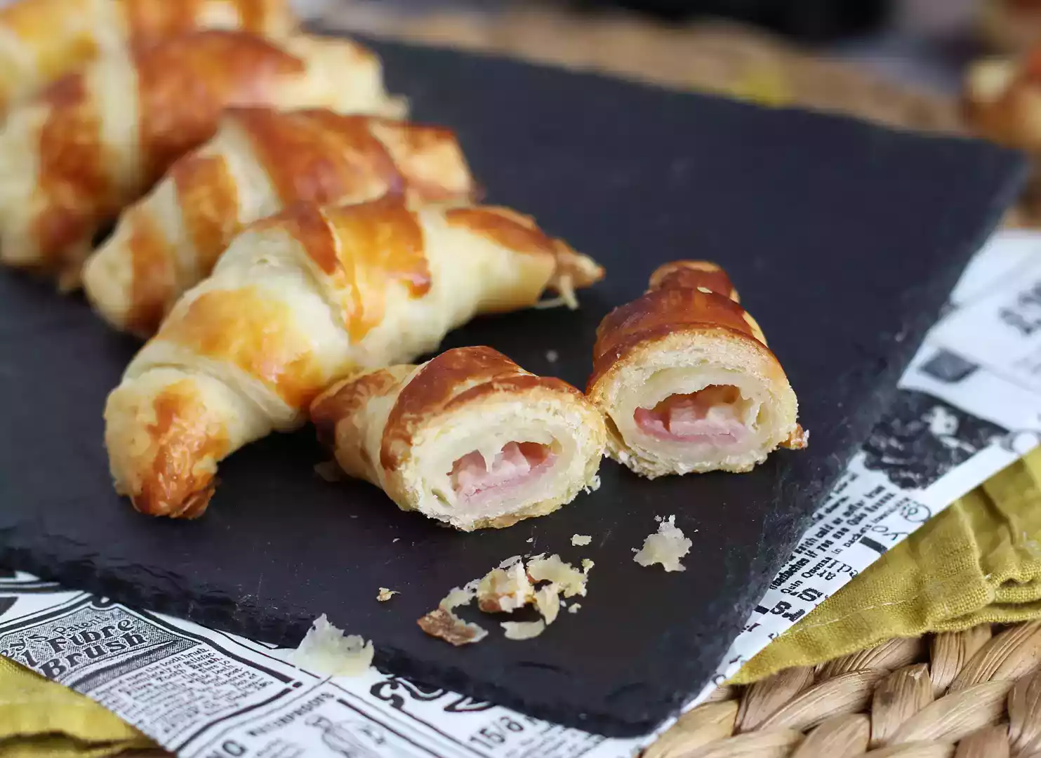 Puff pastry croissants with bechamel, ham, and cheese