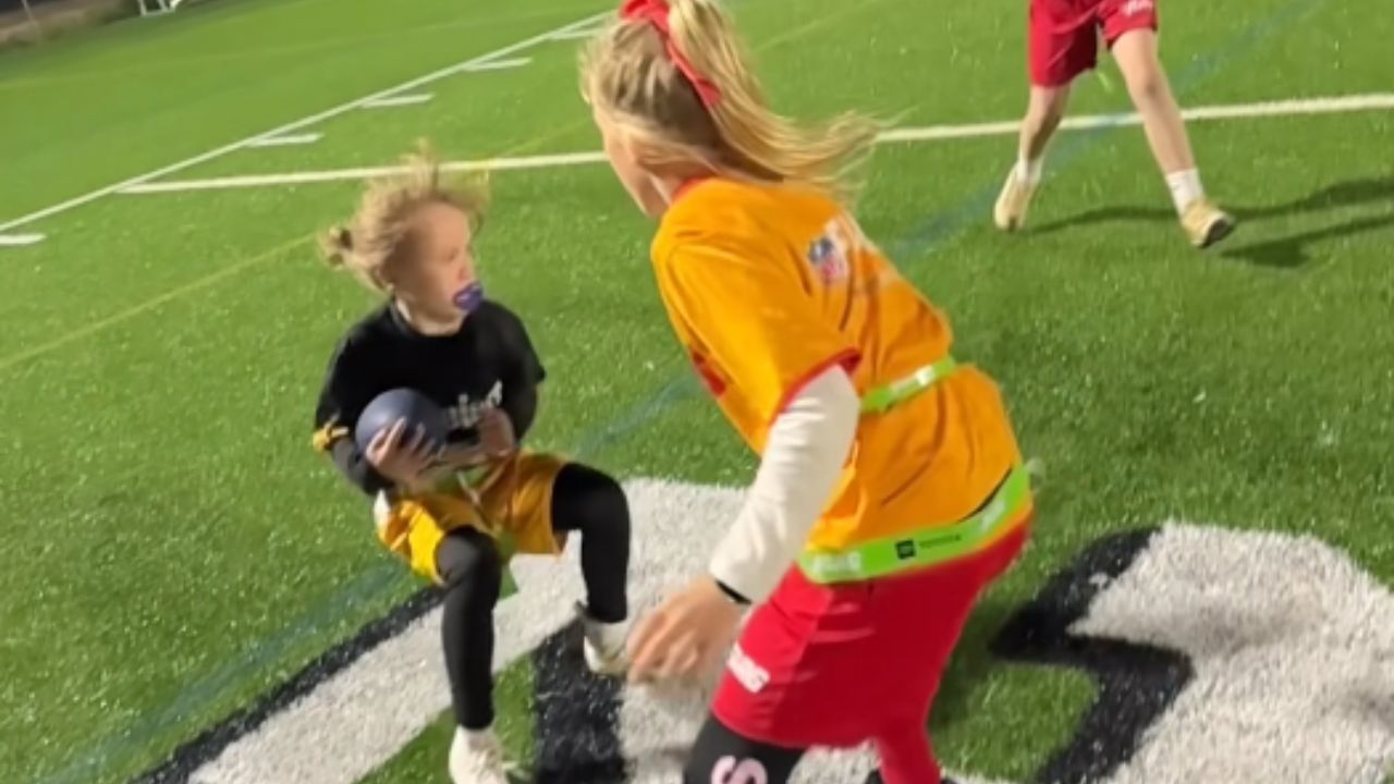 Little girl outsmarts all athletes in flag football game