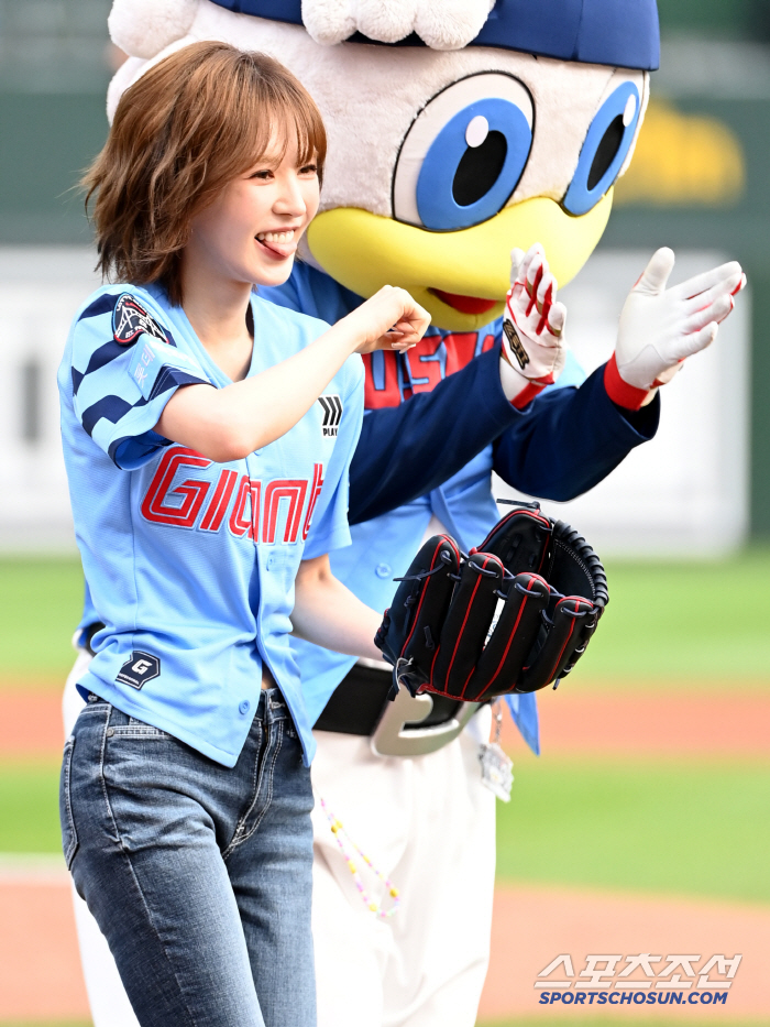 Wendy's shy smile after the first pitch