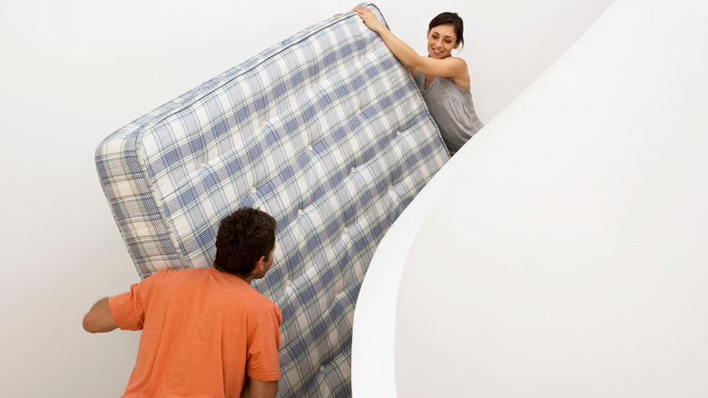 The Tape Hack You Need To Make Moving A Mattress So Much Easier