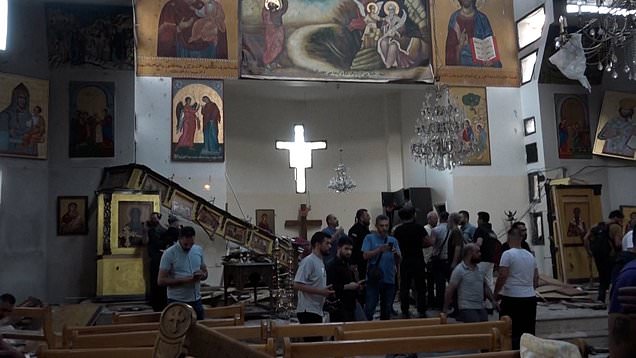Church in ruins as suicide bomber opens fire before detonating ...