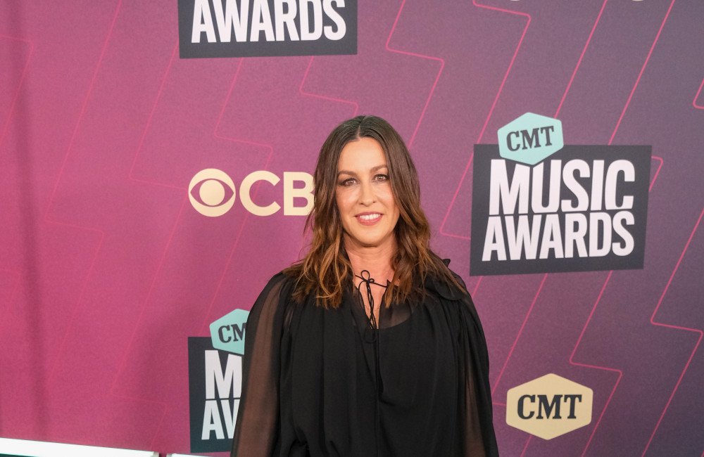 Alanis Morissette sees her long hair as a 'bandmate' because it helps ...