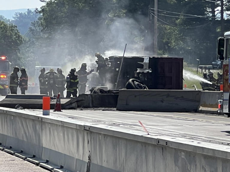 Truck carrying asphalt catches fire after rollover