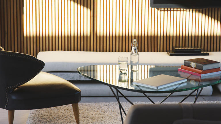 How A Glass Coffee Table Can Visually Declutter A Room