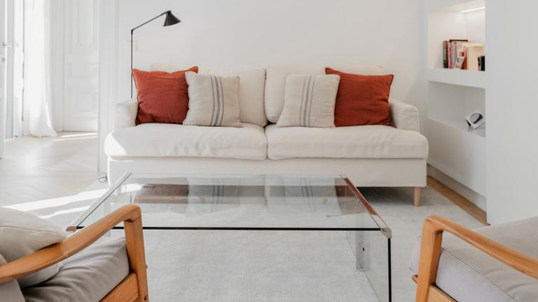 How A Glass Coffee Table Can Visually Declutter A Room