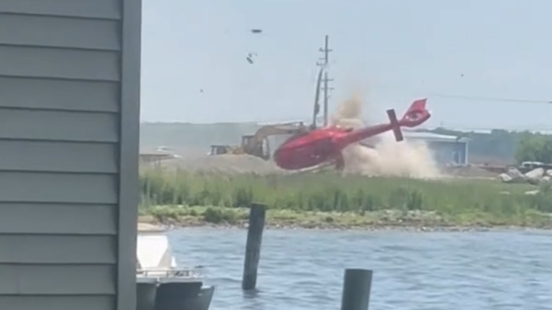 Shocking moment helicopter flips and crashes during landing near Waterfront