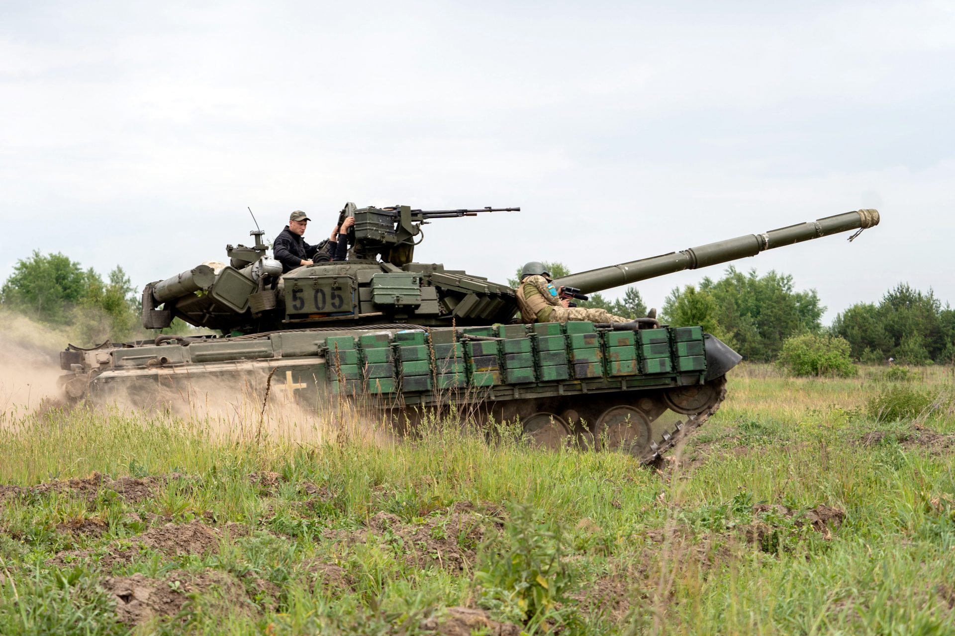 In action: Ukrainian commander faces the flames on his moving tank