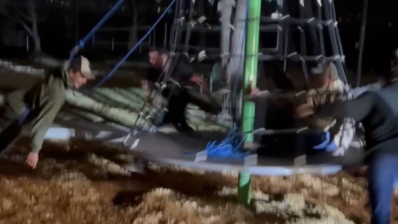 Boys create human slingshot with rope swing during late-night fun at park