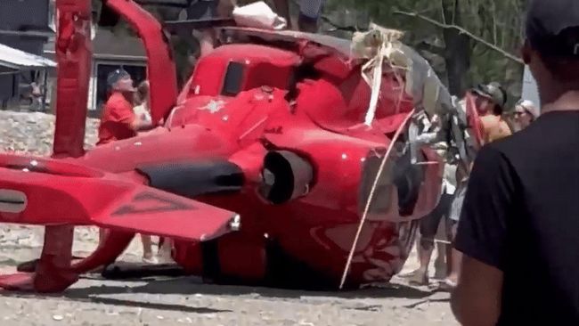 Passengers Exit Helicopter That Rolled on Its Side During Landing
