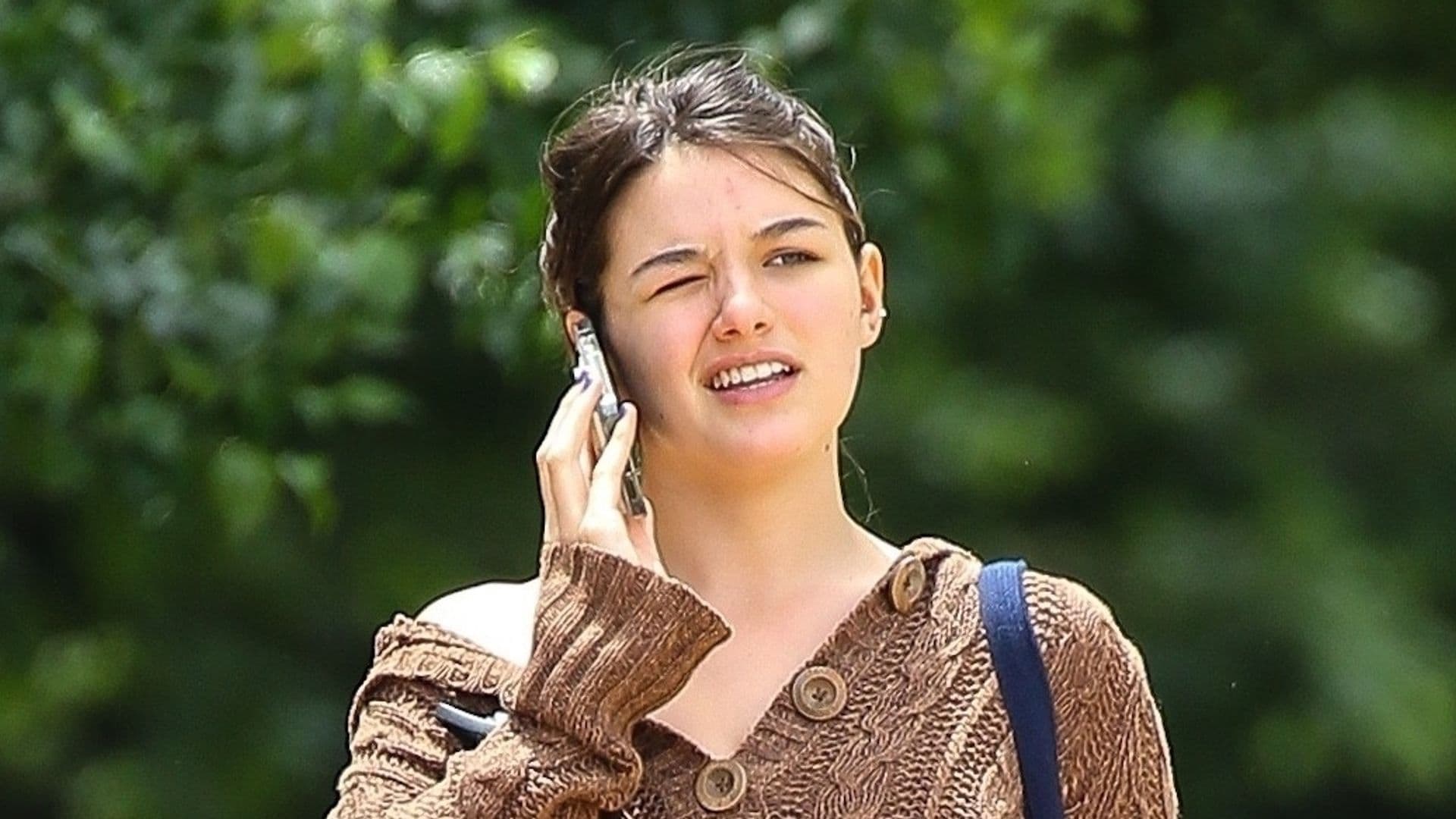 Suri Cruise beats the summer heat with a black tank top and flip-flops