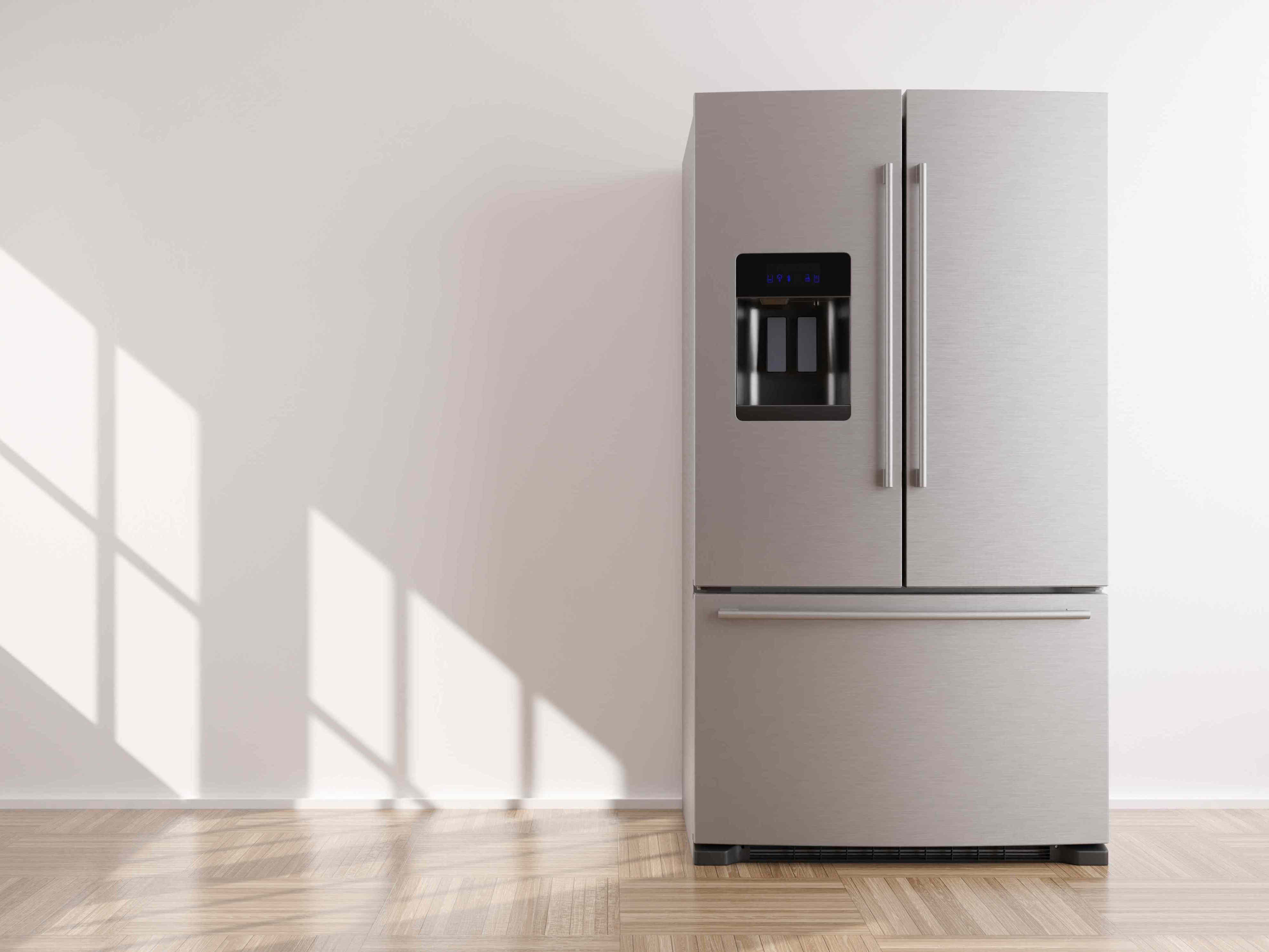 Here’s How Often You Should Actually Clean Behind Your Fridge