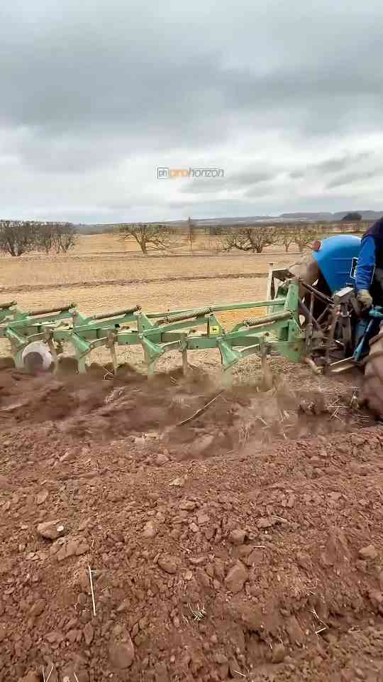 Doe Dual Drive Tractor Ploughing the Fields