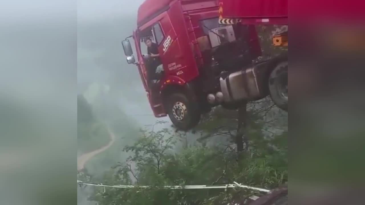 China bridge collapse leaves truck hanging perilously over drop