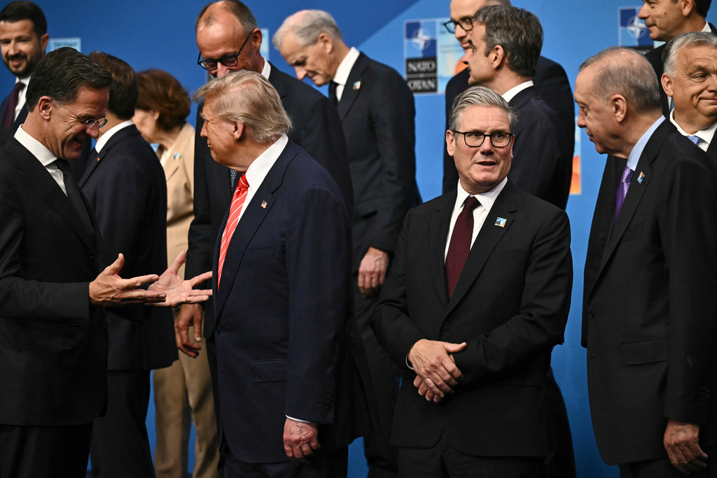 The Latest: NATO leaders agree on spending hike, vow to defend each other