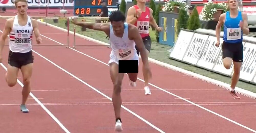 Chris Robinson bursts out of his shorts during 400m hurdle race