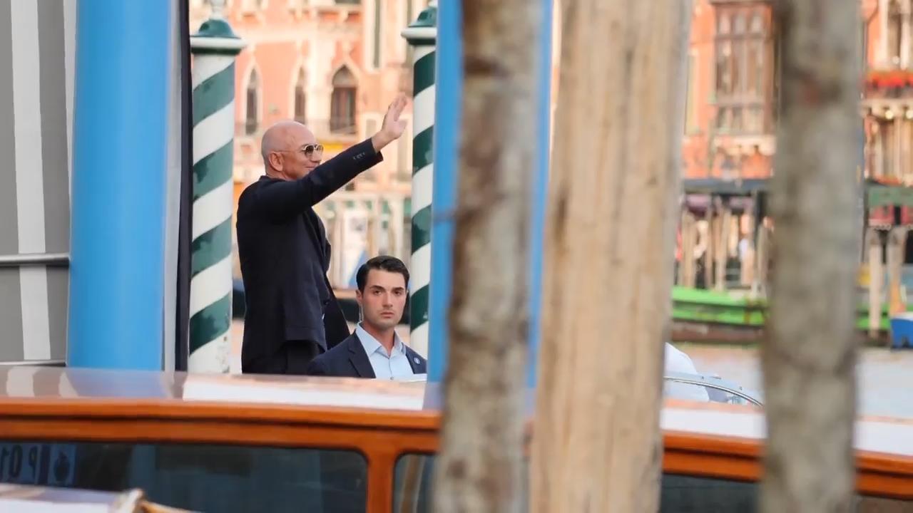 Multi-billionaire Amazon founder Jeff Bezos and Lauren Sanchez wave as ...