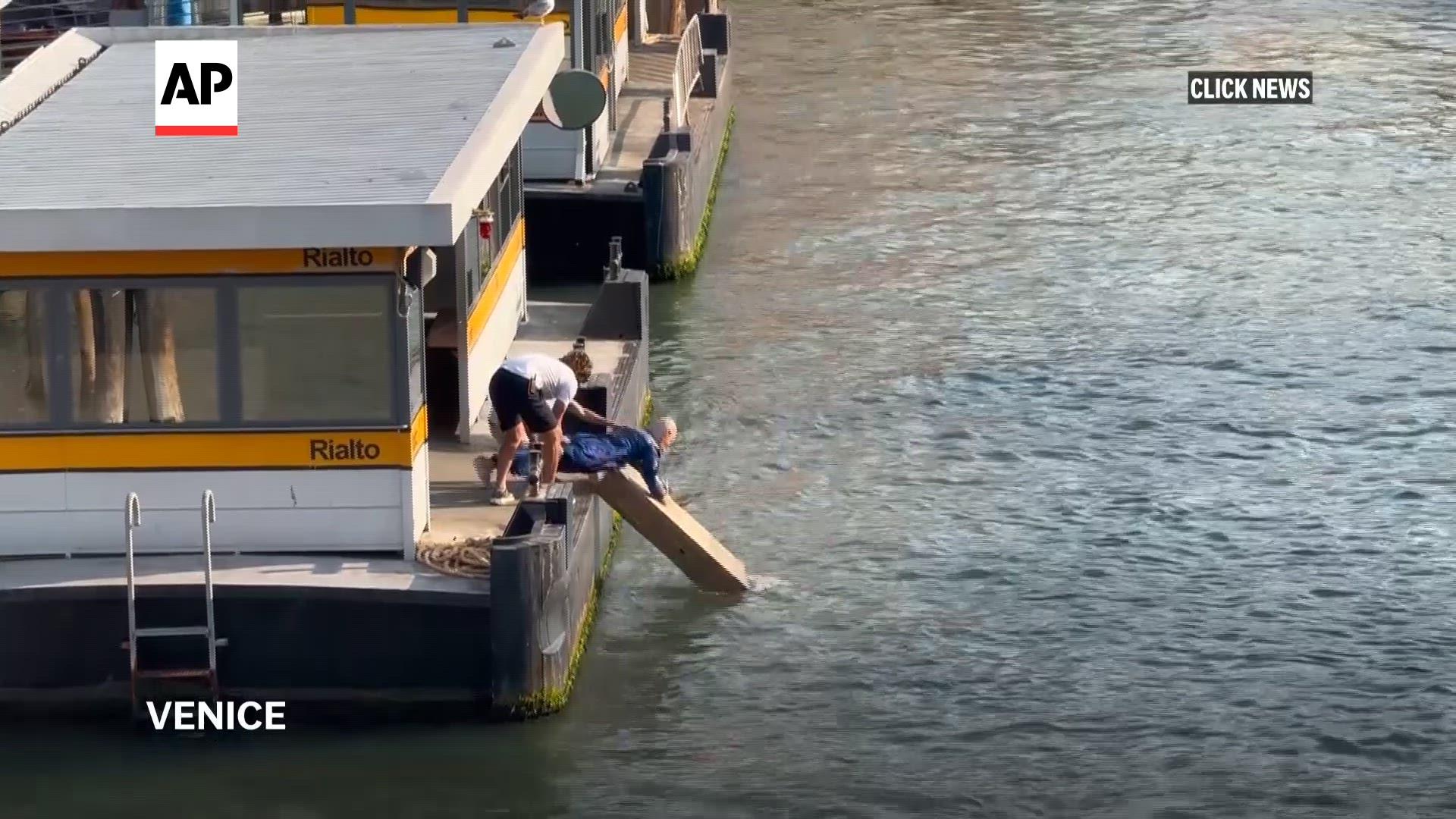 Life-size mannequin of Jeff Bezos lying on a giant Amazon box dropped ...