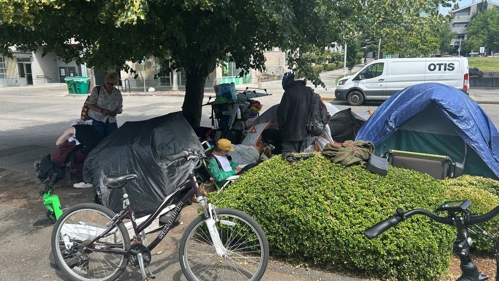 Homeless camp pushed out by fencing, but tents remain near Seattle's ...