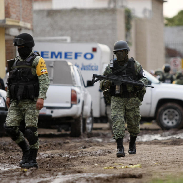 Children among 10 killed by gunmen at house in cartel bastion