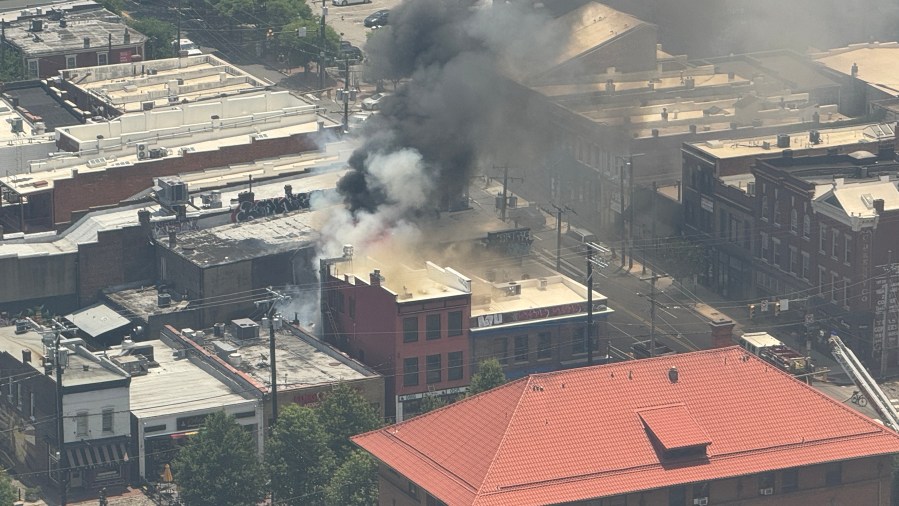 WATCH: Large fire burns through Richmond building, two firefighters ...