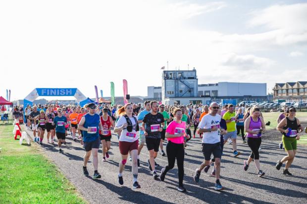 Hundreds raise over £11k in sold-out Solent Airport runway race