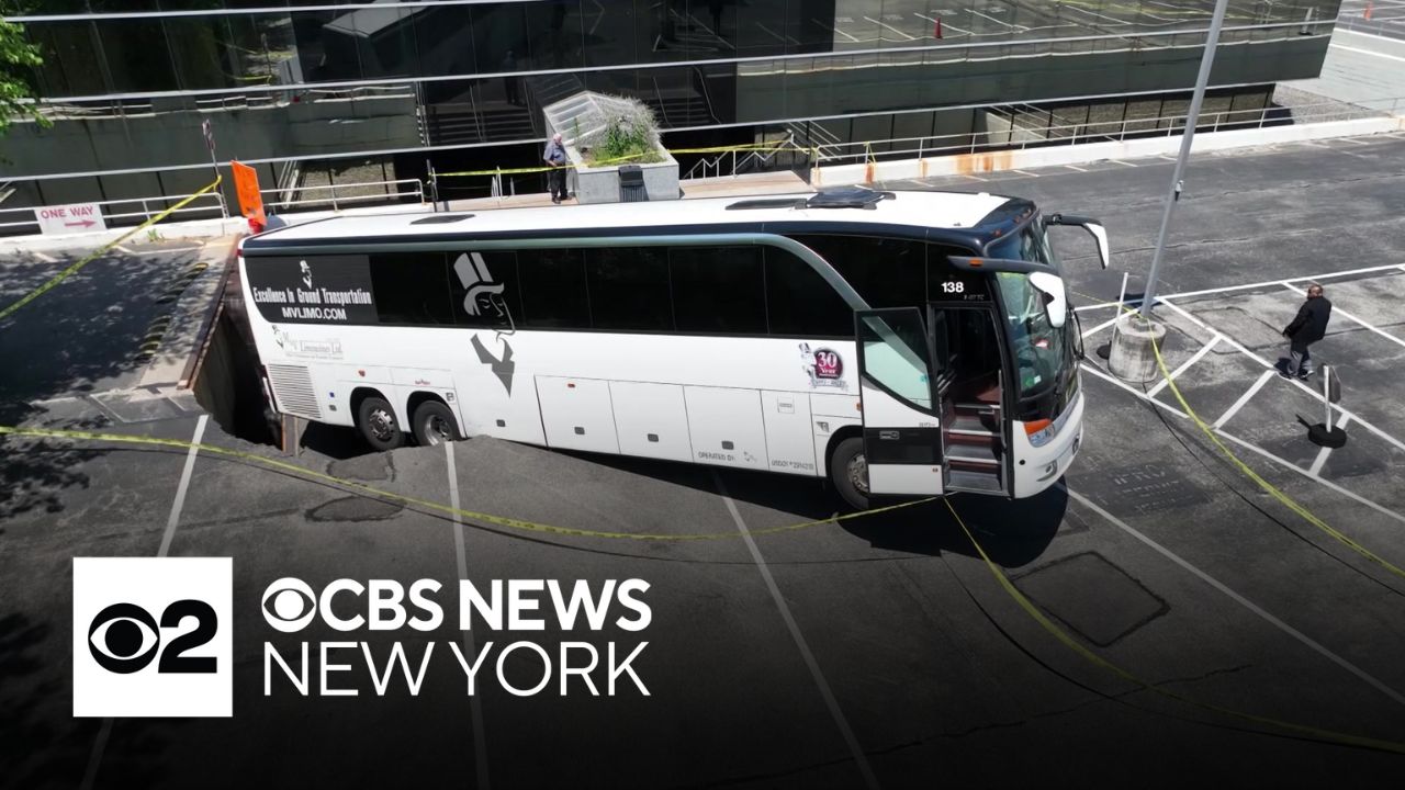 Charter bus remains stuck after sinking into Long Island parking lot