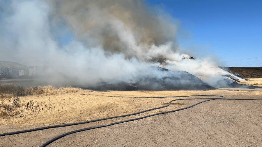 Multiple fire agencies battle hay fire in Stanislaus County