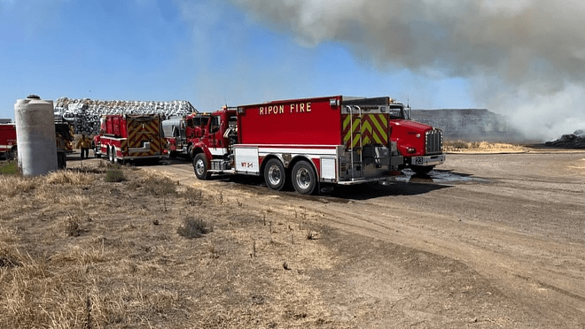 Multiple fire agencies battle hay fire in Stanislaus County