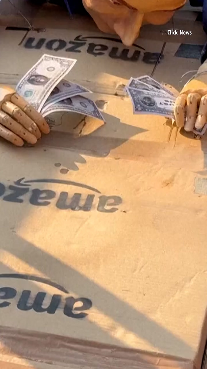 Protestors Push Jeff Bezos Dummy, Clutching an Amazon Box and Fistfuls ...