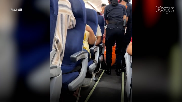Passenger Forcibly Dragged Off Plane by Arms and Belt After Alleged ...