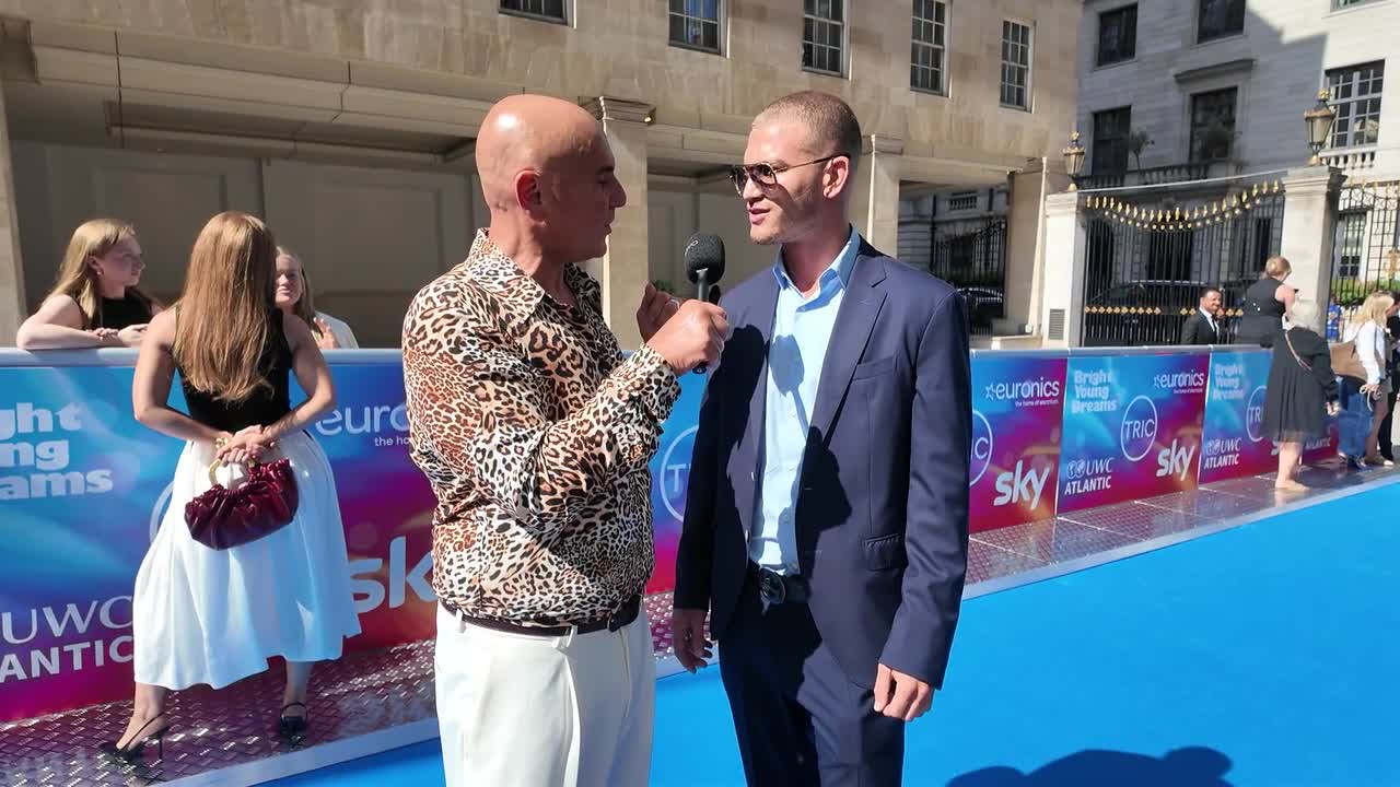 Love Island star Blu Chegini chats on the red carpet at the Tric Awards