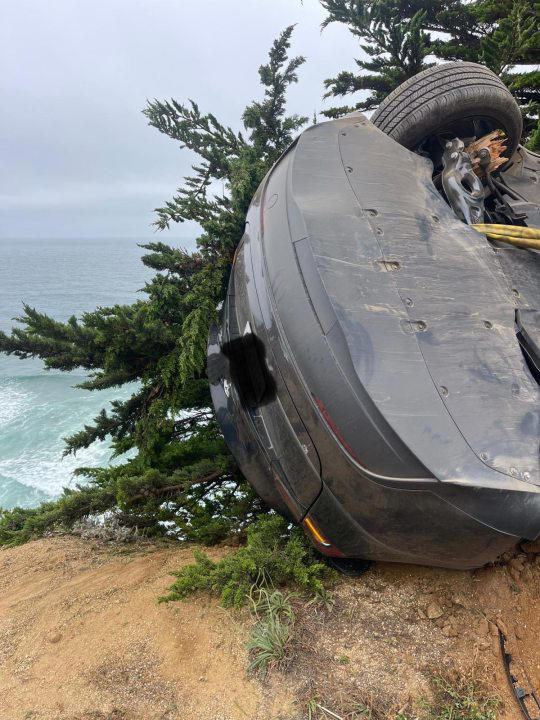 ‘Close call’: Driver gets trapped in Tesla dangling over California ...