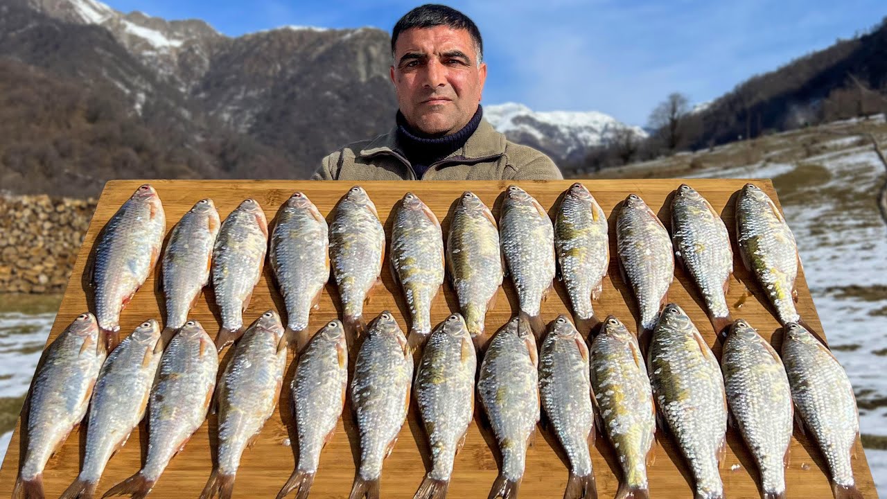 Fresh lake fish fried outdoors in the village