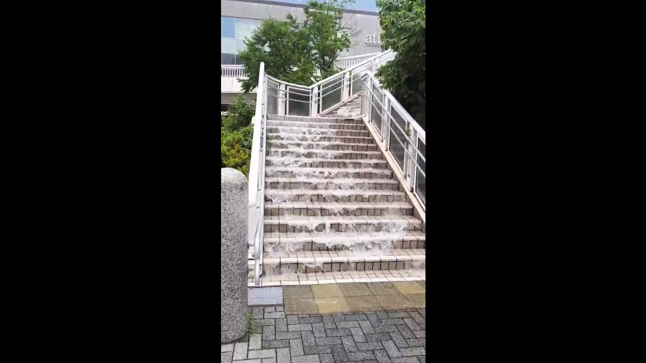 Flood sends water gushing down pedestrian stairs
