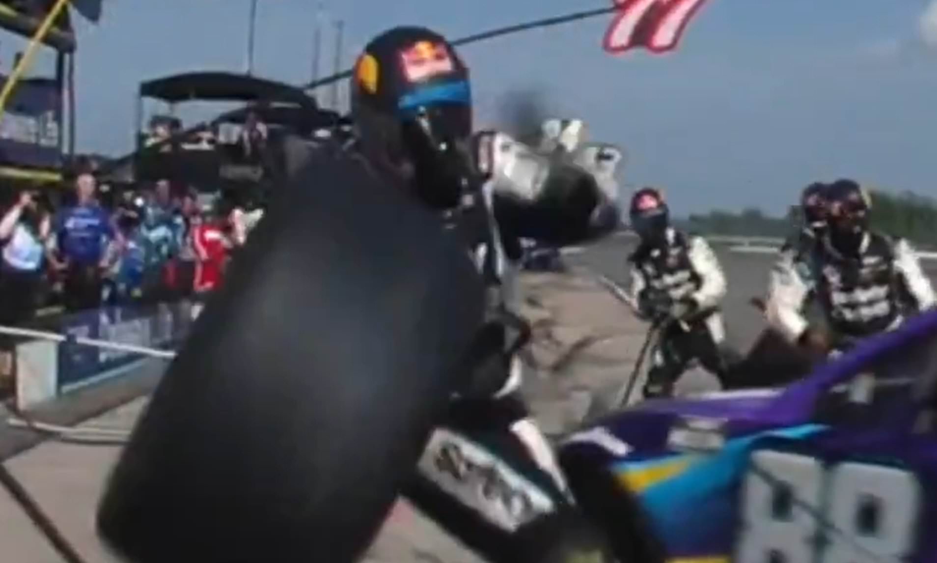 Shocking moment NASCAR mechanic is struck by a flying tire during pit stop