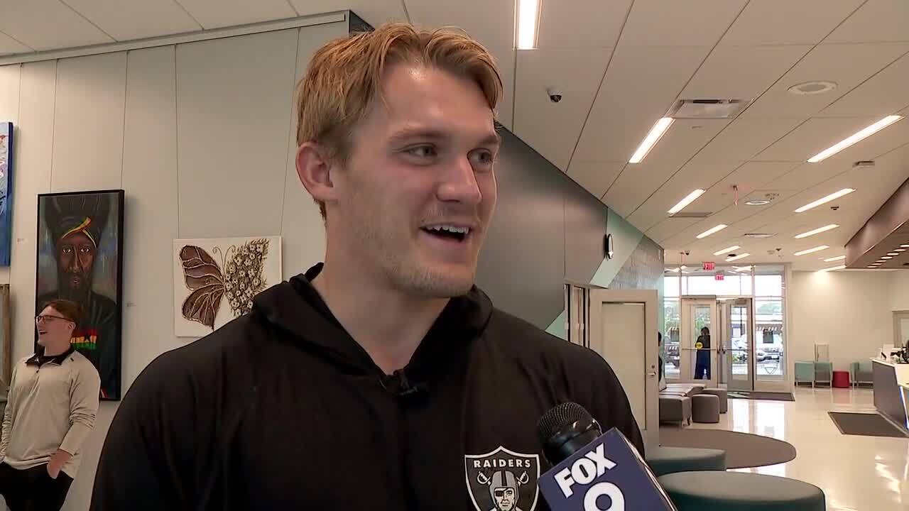 Cody Lindenberg delivers meat sticks to Anoka football team