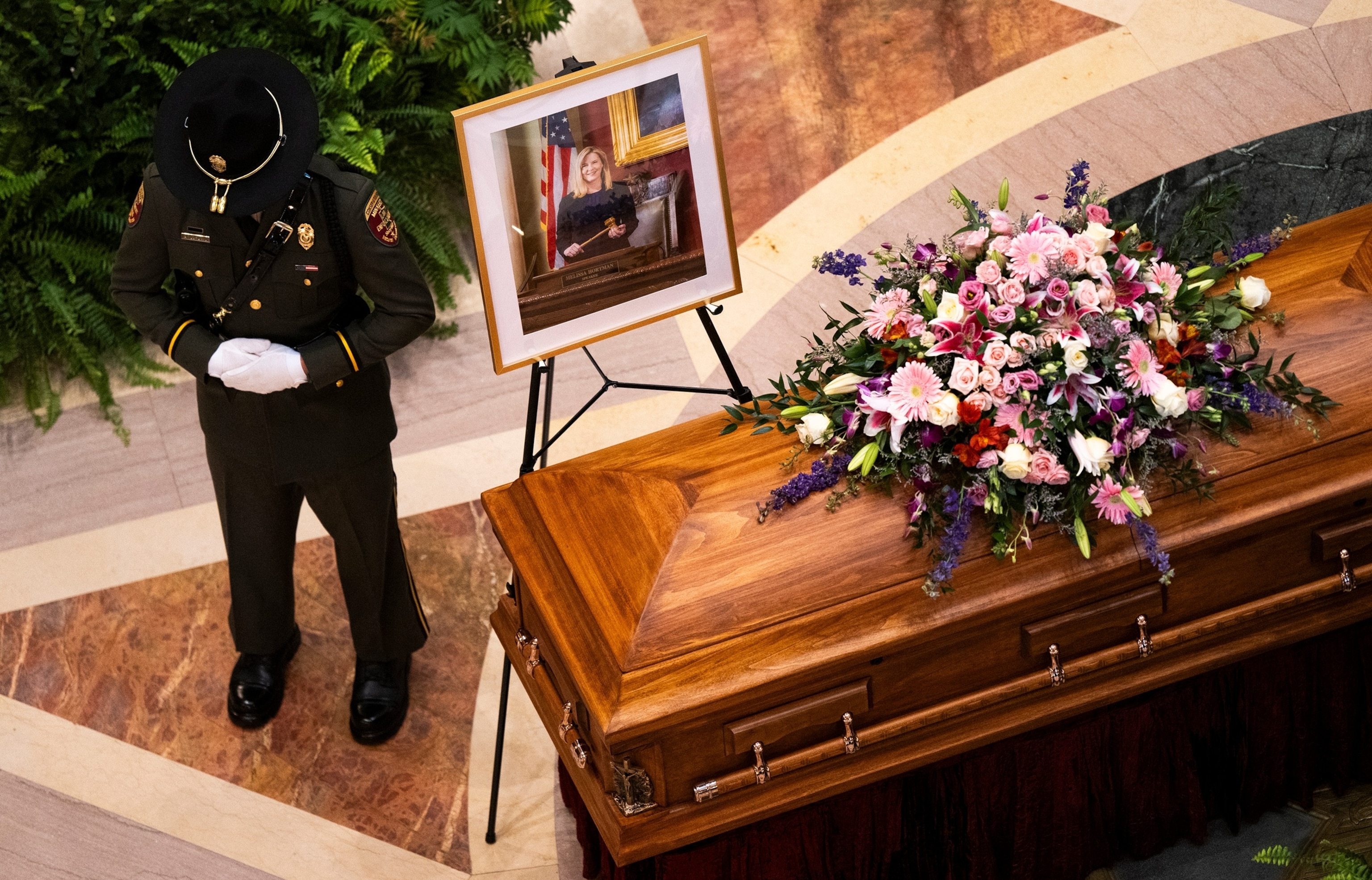 Slain lawmaker lies in state with her husband and dog at Minnesota capitol