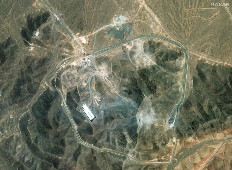 Satellite images appear to show excavators and bulldozers at work at ...