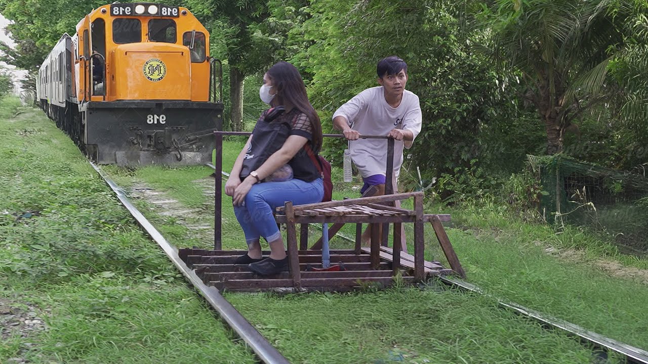 Riding Cheapest Handmade Trolley in the Middle of Giant Trains