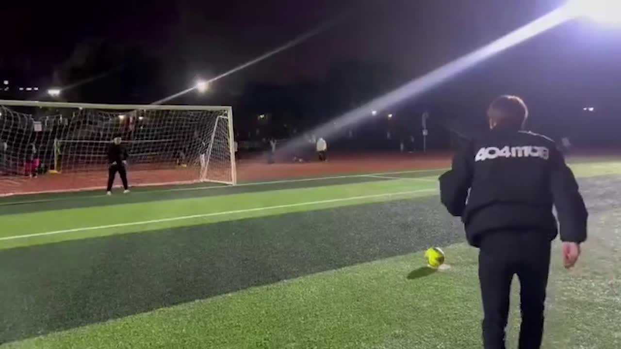 Football players shoe flies off as he tries to take penalty kick