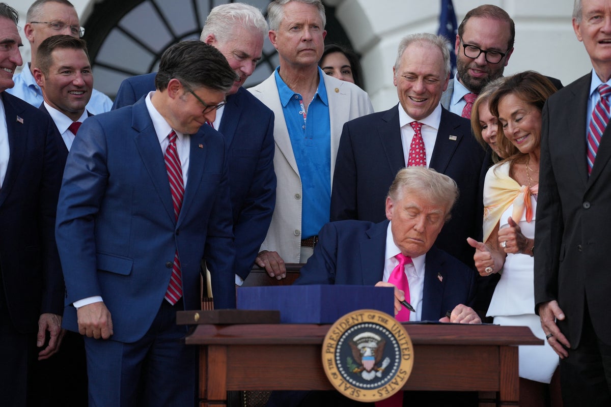 Trump celebrates signing of narrowly passed bill during White House ...