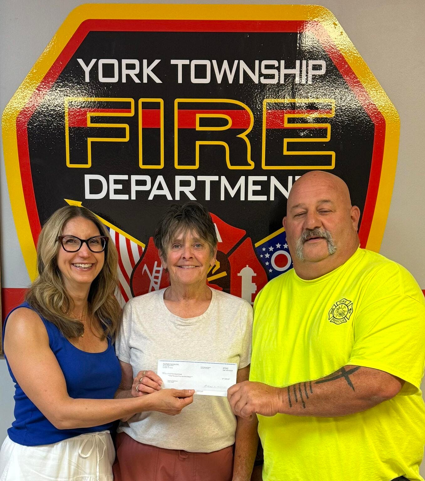 Fairfield Homes employee donates to fire department where late husband ...