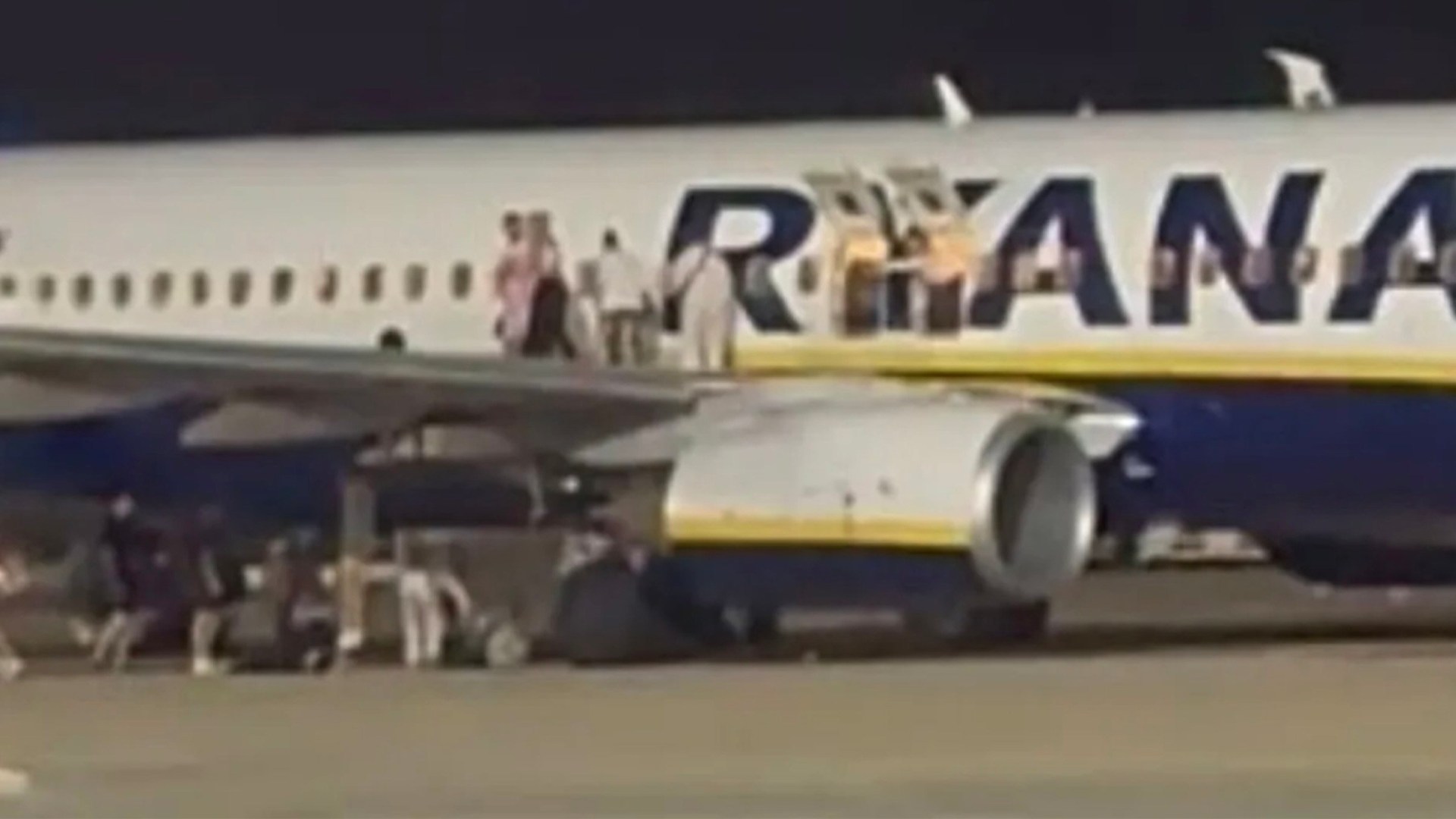 Ryanair passengers escape on plane's wing after 'fire'