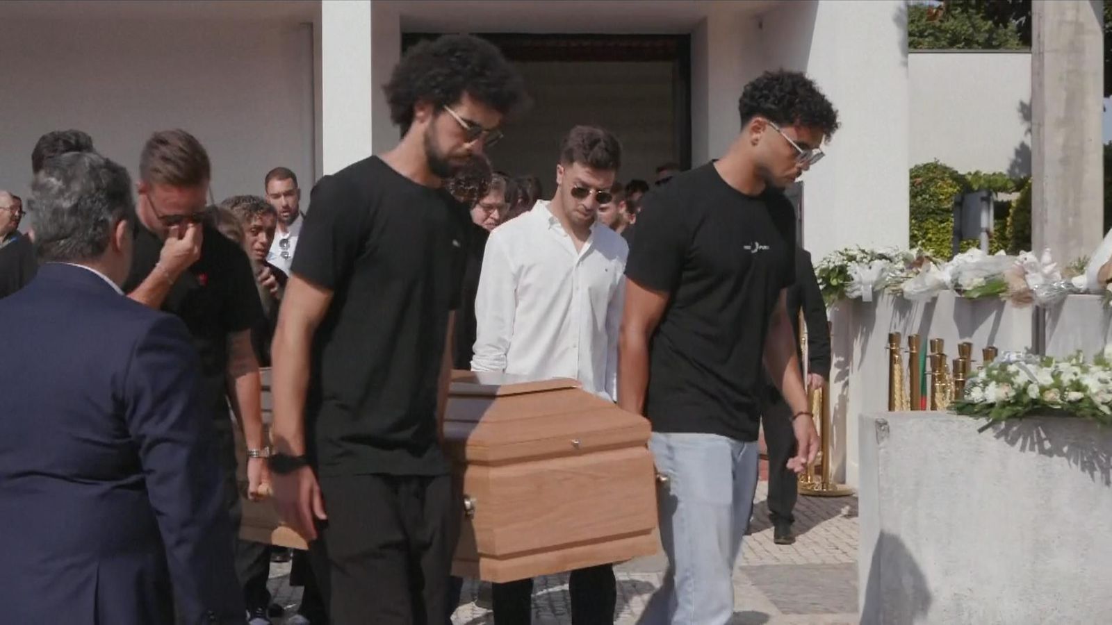 Funeral held for football star brothers